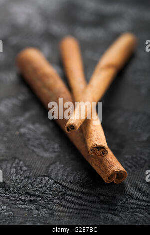 Close up of a three cinammon sticks on a white backgraound Stock Photo ...