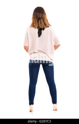 Woman posing with her back faced to camera, isolated over copy space ...