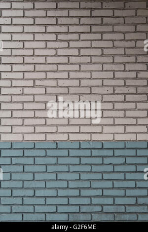 An ivory brick wall with vertical bricks is shown, showcasing a clean ...
