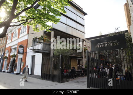 The Half Moon pub in Stepney Green on the Mile End Road, in east London ...