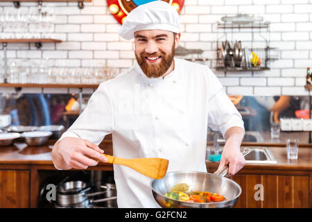 Mixed vegetables on a frying pan. Cooking time Stock Photo - Alamy