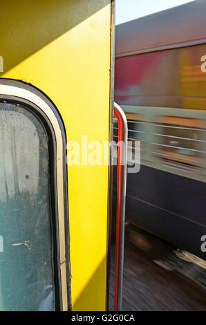 Indian countryside as viewed from the footboard of a running train ...