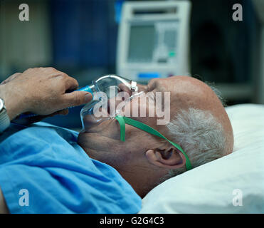 Medical mask on an old man Stock Photo - Alamy