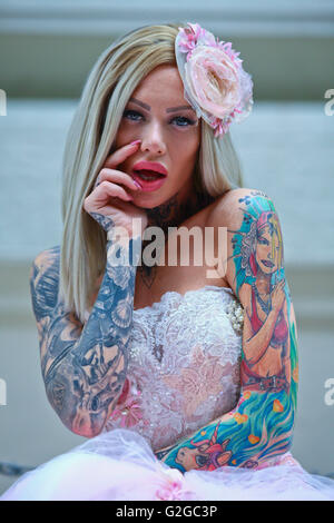 Becky Holt showcasing tattoos and wedding dress by Philippa Lusty at ...