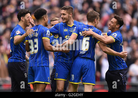 Wimbledon players celebrate after the Sky Bet League 2 Playoff Final ...