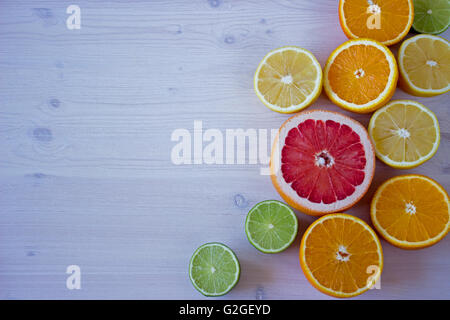 Citrus fruits. Over wood table background Stock Photo - Alamy