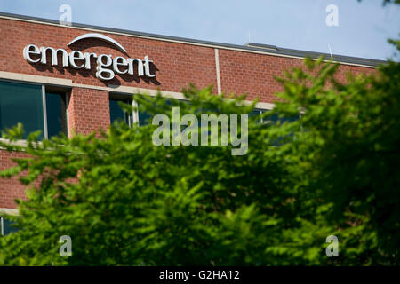 A logo sign outside of the headquarters of Emergent BioSolutions in ...