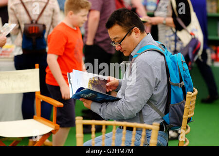 Visitors browse books at the Beijing Book Fair 2026 in Beijing, China ...