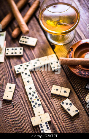 traditional cuban domino game, cigars and rum on wooden table Stock ...