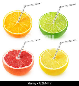 Lemon halves with fresh lemon juice in the back, photographed on wood ...