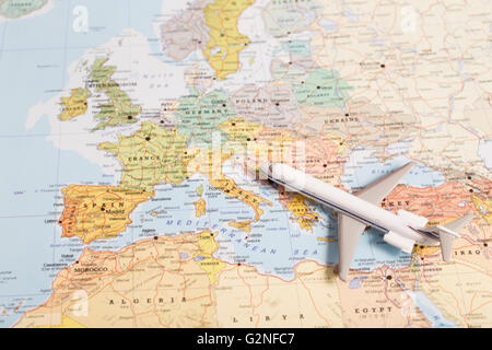 Toy of a plane flying over the Europe map Stock Photo - Alamy