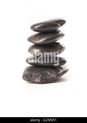 Hot Stones stacked on white sand Stock Photo - Alamy