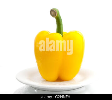 Yellow capsicum pepper isolated on a black background Stock Photo - Alamy