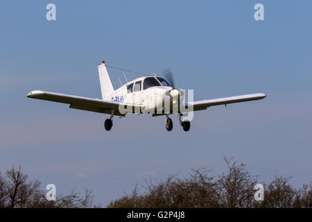 Piper PA-28-180 Cherokee G-BXJD in flight after take-off from Stock ...