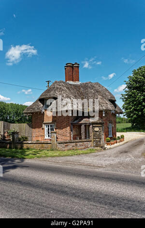 traditional small thatched cottage at the entrance to gaunts house near ...