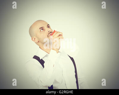 bald male cleaning worker spraying liquid detergent in front of him ...