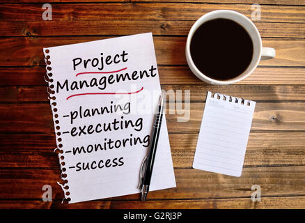 Project Management Process text on white sketchbook with color pen, top ...