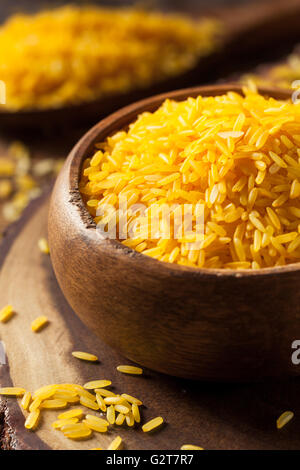 Raw Organic Yellow Saffron Rice in a Bowl Stock Photo - Alamy