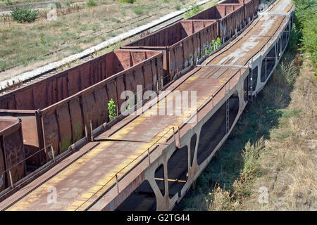 old rusty iron freight wagons of the railway Stock Photo - Alamy