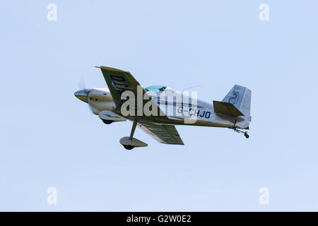 Midget Mustang G-CHJO in flight at North Coates Airfield Stock Photo ...