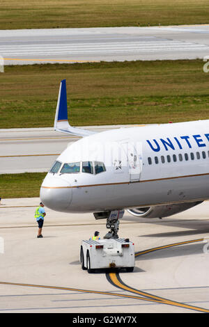 United Airlines jet being pushed back at Miami International Airport in ...