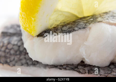 Hake fillet with skin and lemon, macro, as background, soft focus Stock ...