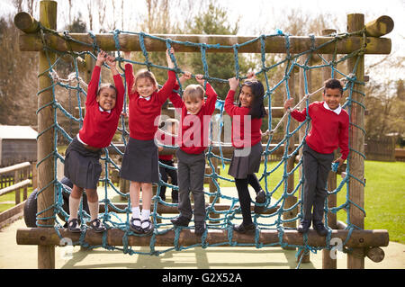 Girls and boys on the school climbing apparatus in south London primary ...