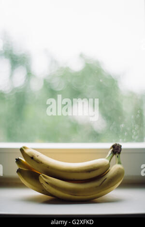 bunch of bananas on the window Stock Photo - Alamy