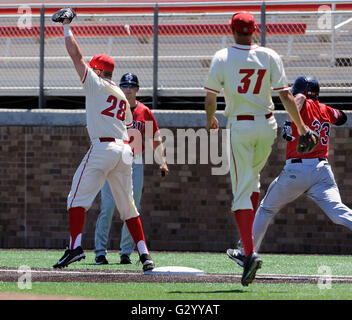 Lubbock, TX, USA. 5th June, 2016. UNM's #23 Jared Holley makes the tag on Dallas Baptist ...