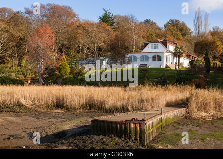 white chalet bungalow with it's own jetty on the river hamble esturary ...
