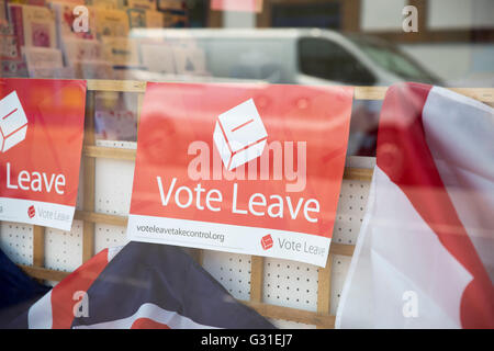 A Vote Leave campaign poster situated inside a shop window in ...