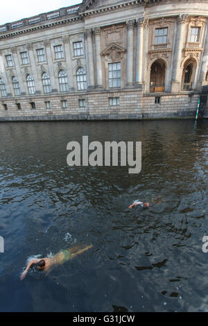People swim in the river Spree in Berlin, Germany, to demand the lift ...