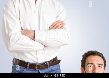 Height difference between two men in a blue background Stock Photo - Alamy
