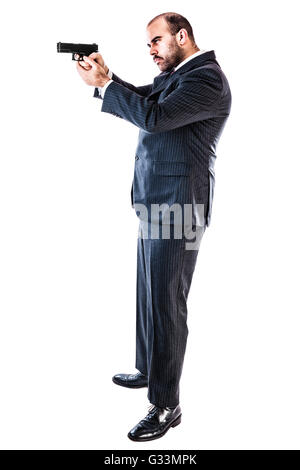 portrait of a classy businessman or mobster or security guard holding a ...