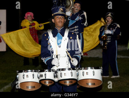 High school band marching drums section in parade (snare drums, tenor ...