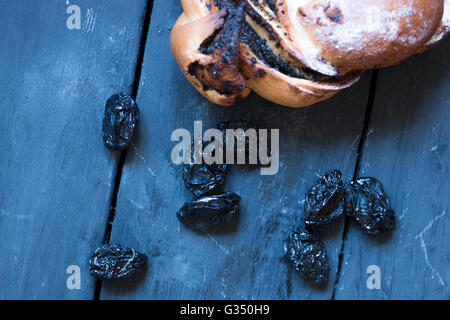 Delicious breakfast prunes on a dark wooden table Stock Photo - Alamy