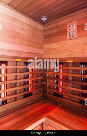 a small wooden infrarered sauna booth in a spa. Infrared Saina cabin in ...