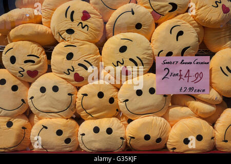 Smiley face cushions in a shop display Stock Photo - Alamy