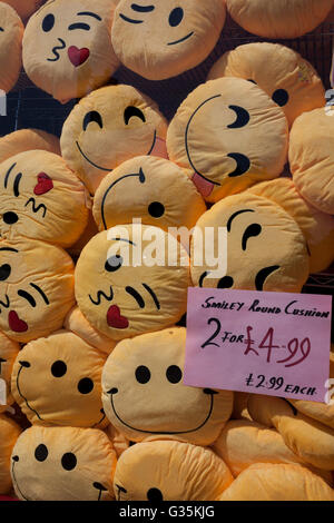 Smiley face cushions in a shop display Stock Photo - Alamy