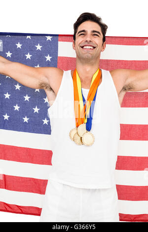 Male athlete holding up gold medal Stock Photo - Alamy