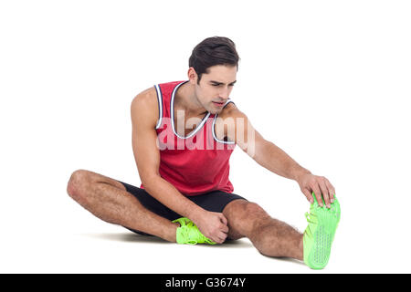 Male athlete stretching his hamstring Stock Photo - Alamy