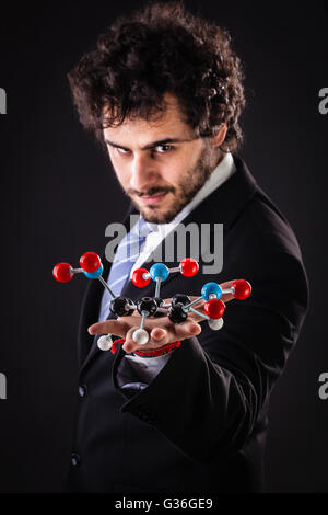 TNT molecule. Molecular model of trinitrotoluene (TNT, formula C7H5N3O6 ...