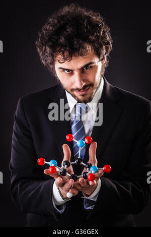 TNT molecule. Molecular model of trinitrotoluene (TNT, formula C7H5N3O6 ...