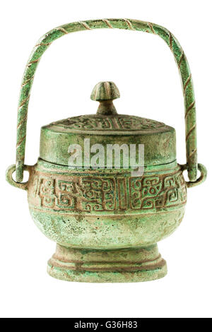 a corroded ancient chinese container isolated over a white background ...