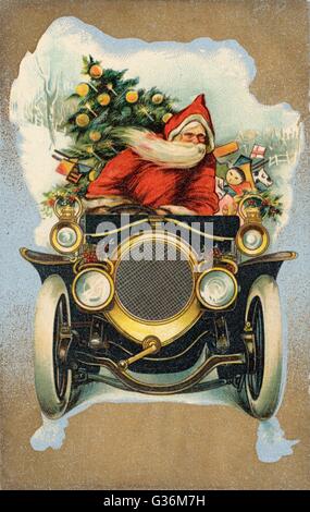 Father Christmas delivering presents by car Stock Photo - Alamy