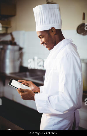 Chef using digital tablet Stock Photo - Alamy