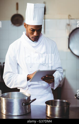 Chef using digital tablet Stock Photo - Alamy