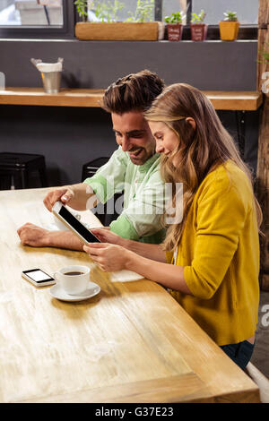 attractive couple using tablet Stock Photo - Alamy