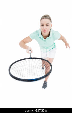 Pretty blonde playing badminton Stock Photo - Alamy