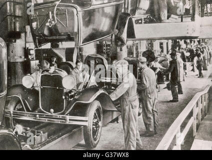 Working on the Ford assembly line in Detroit, USA, 1913. Date: 1913 ...
